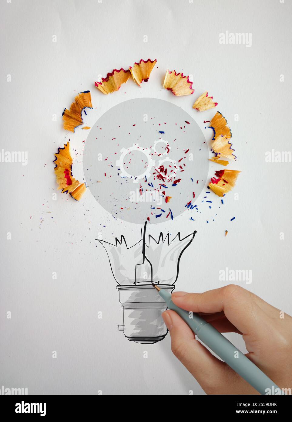 hand drawing light bulb with pencil saw dust and gears icon on paper ...