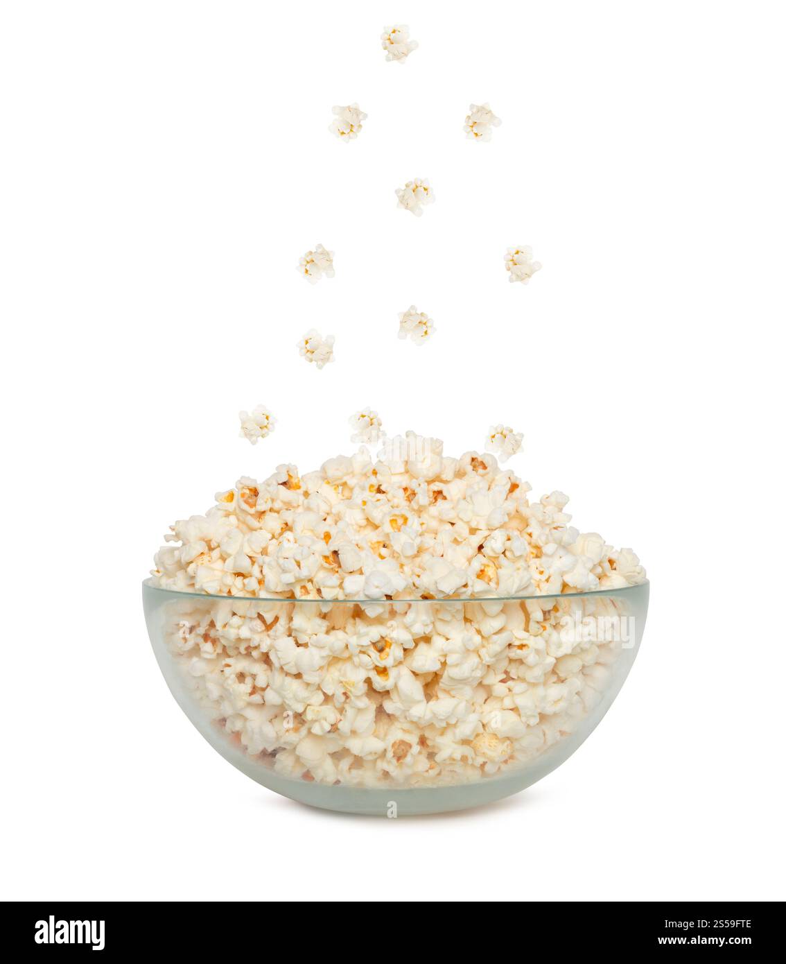 Delicious popcorn in bowl over white background. Popcorn falling in a ...