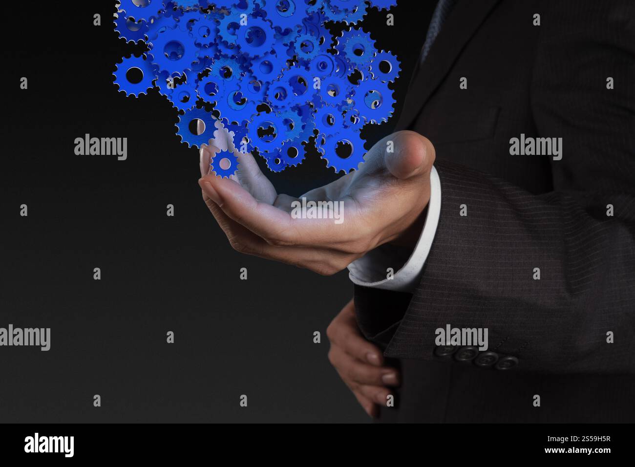 businessman hand showing gears cogs to success concept Stock Photo - Alamy
