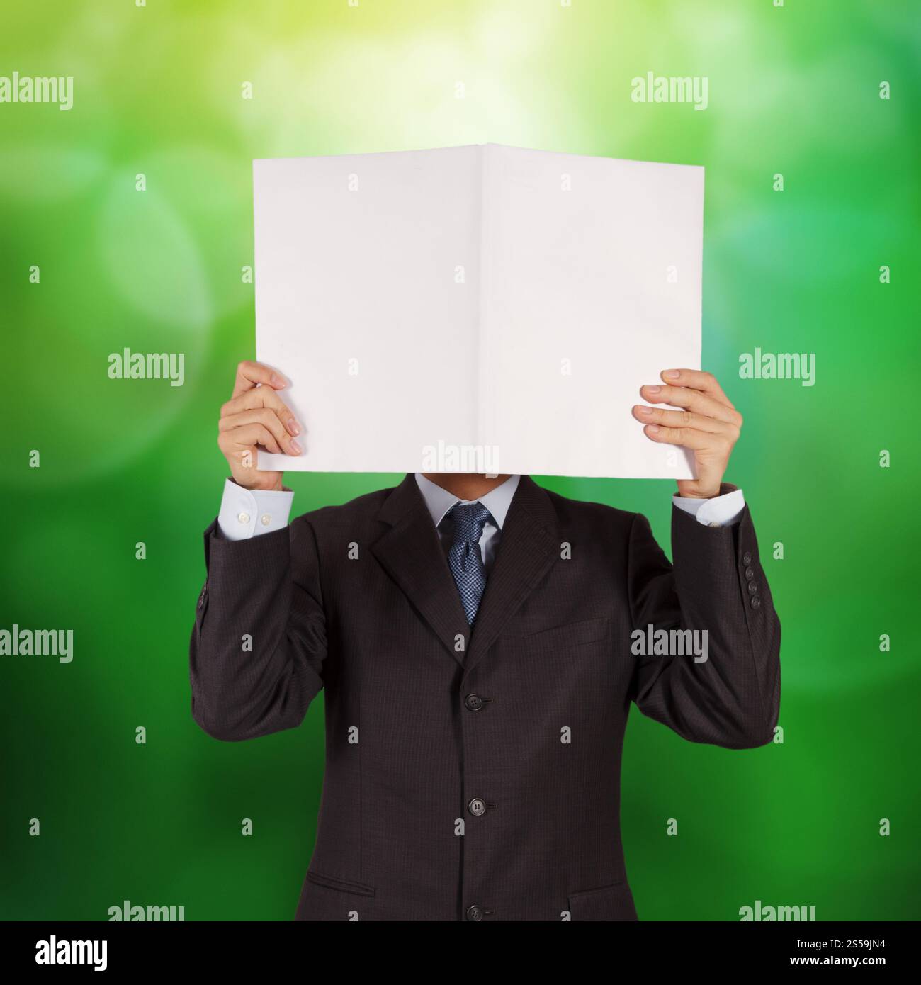 businessman with open book over abstract light background as concept ...