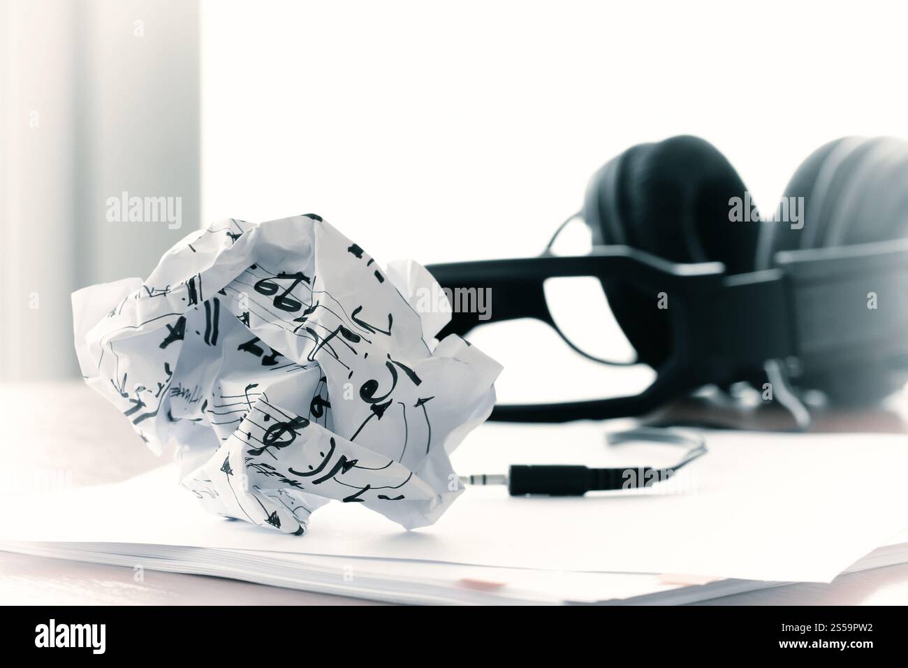 composing music concept with shallow DOF evenly matched crumpled ...