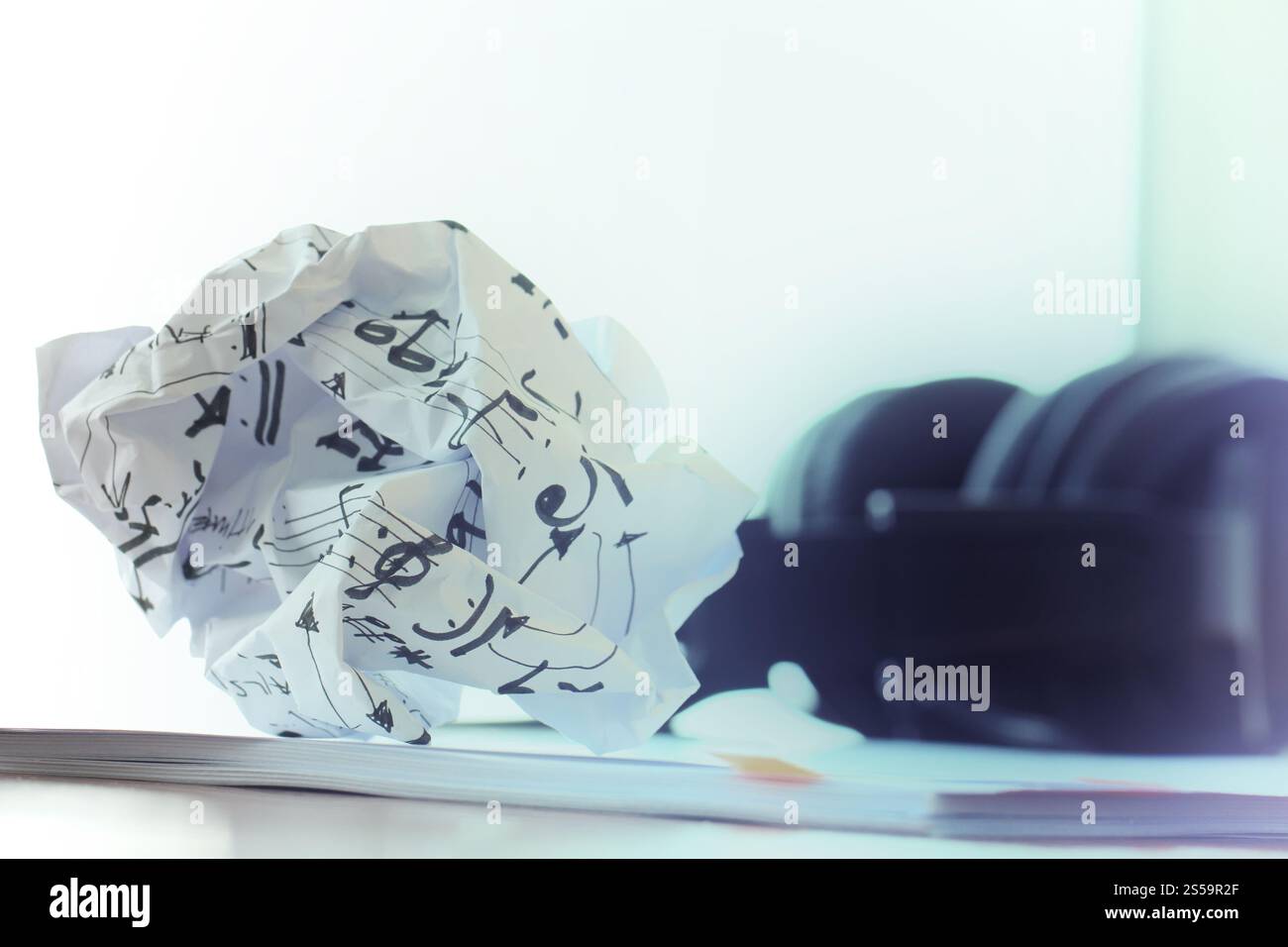 composing music concept with shallow DOF evenly matched crumpled ...