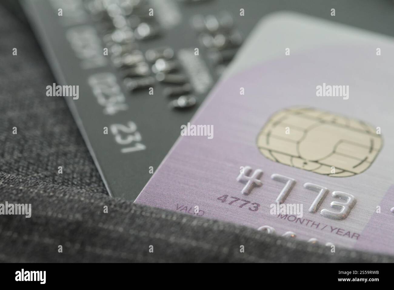 Credit cards in very shallow focus with gray suit background as online ...