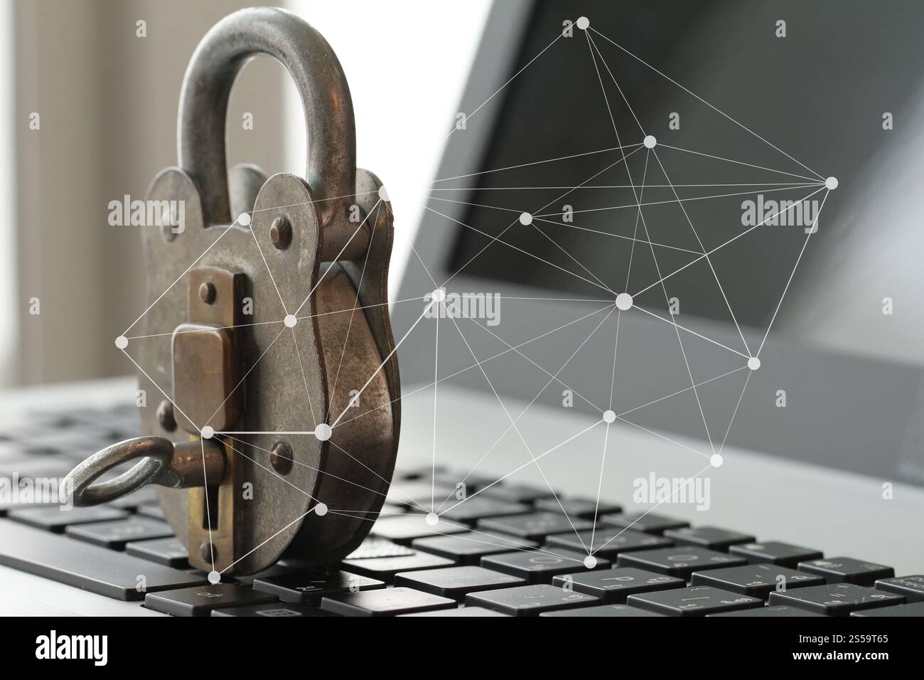 Internet security concept-old padlock and key on laptop computer ...