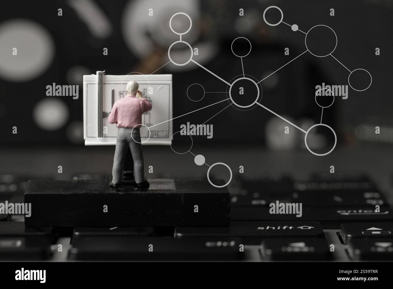 industry concept-miniature engineer working with drafting table on ...