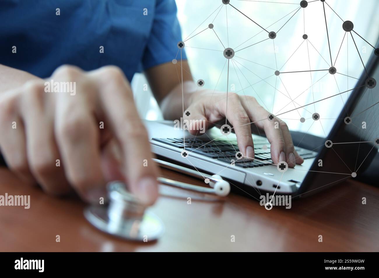 Doctor working with laptop computer in medical workspace office and ...