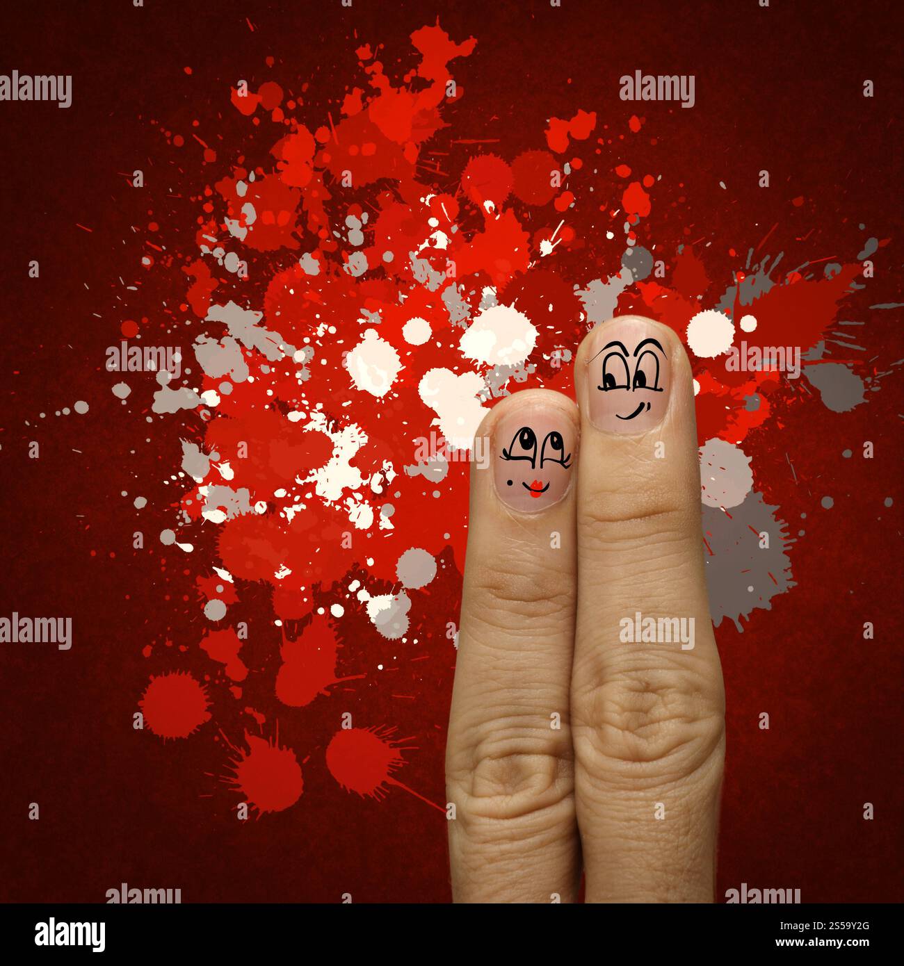 the happy finger couple in love with painted smiley and hold heart as ...