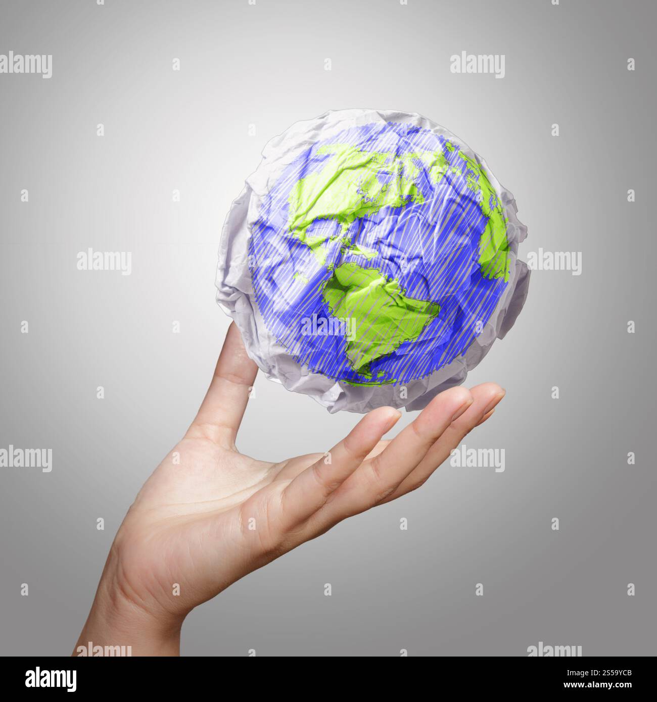hand showing crumpled world paper symbol as concept Stock Photo - Alamy