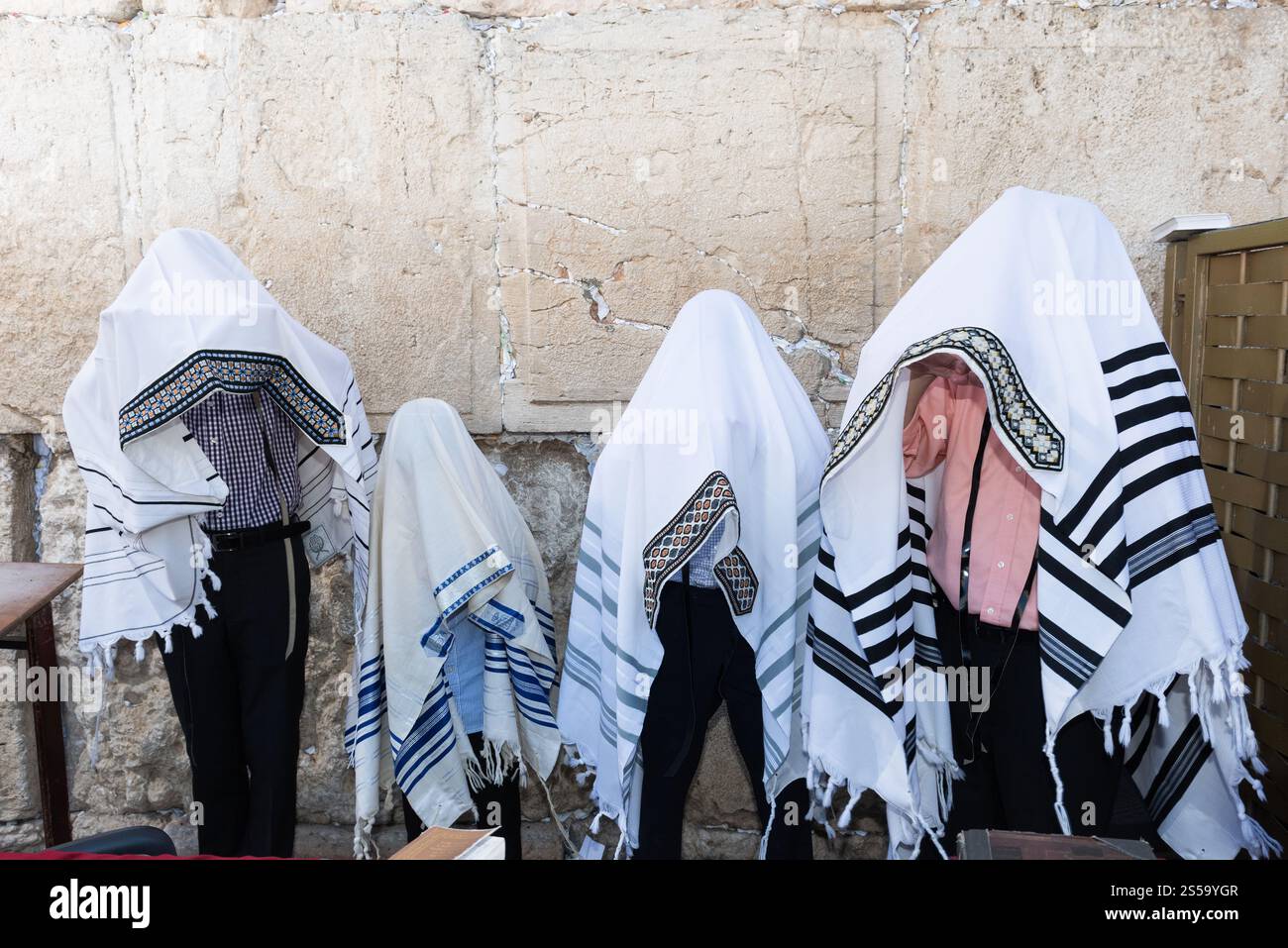 Cohanim or Jewish priests cover their heads with their prayer shawls ...