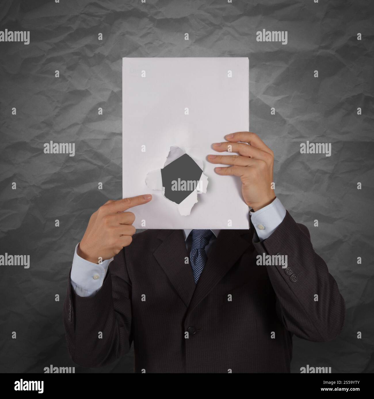 businessman hand show black cover book with crumpled recycle paper ...