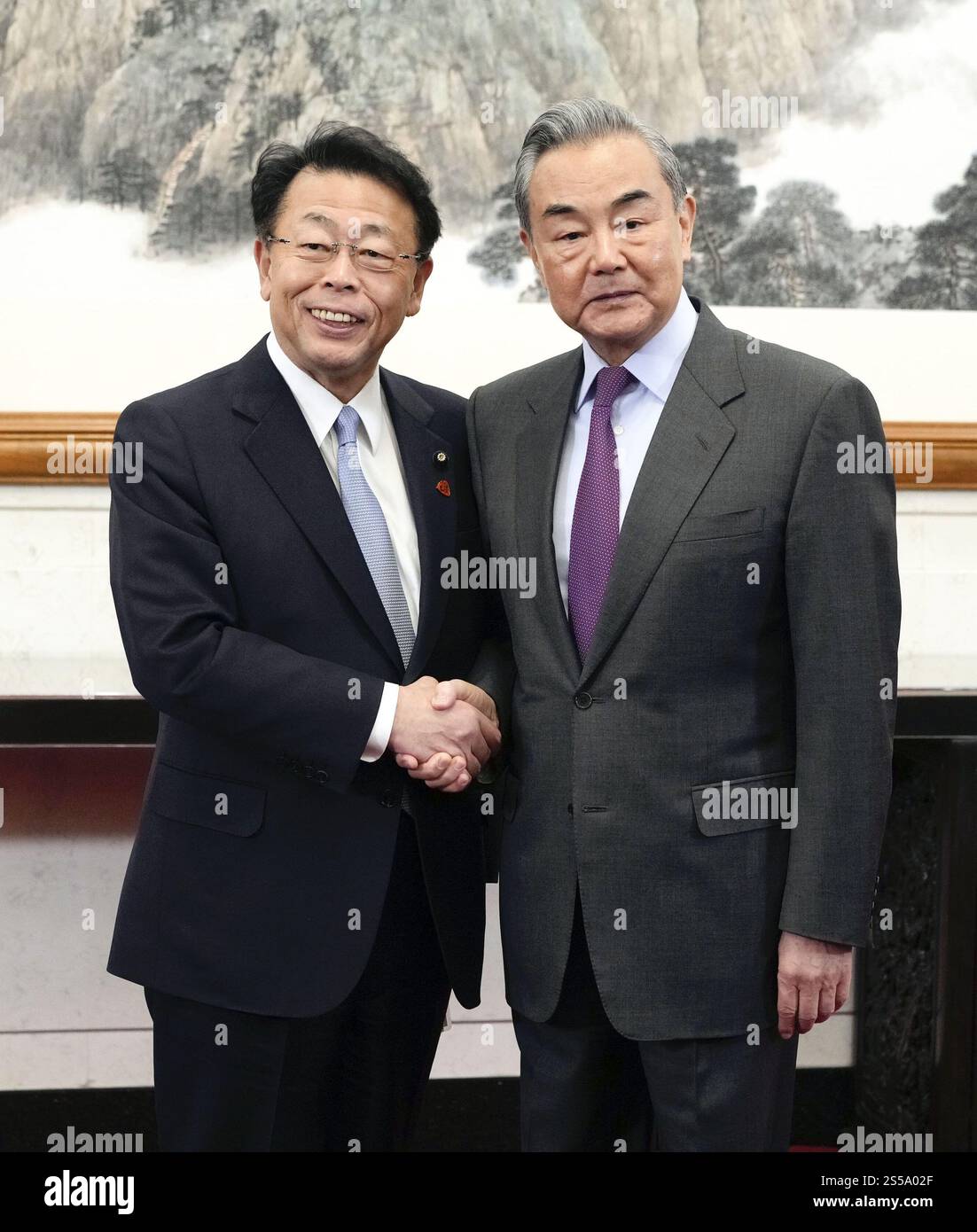 Chinese Foreign Minister Wang Yi (R) and Makoto Nishida, secretary ...