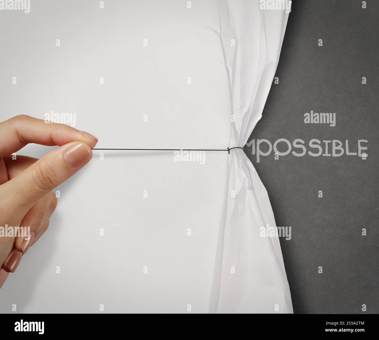hand pull wrinkled paper show word impossible transformed into possible ...