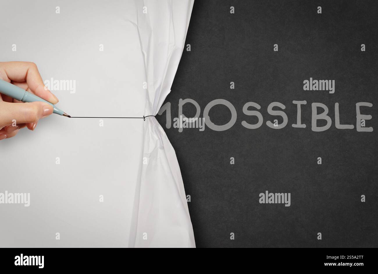 hand pull wrinkled paper show word impossible transformed into possible ...