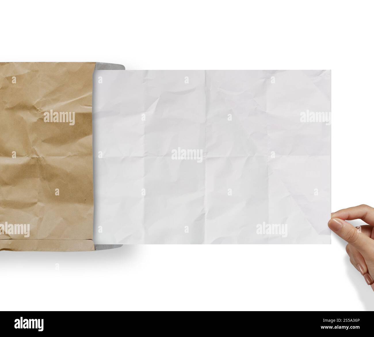 hand pulling crumpled paper from recycle envelope as concept background ...