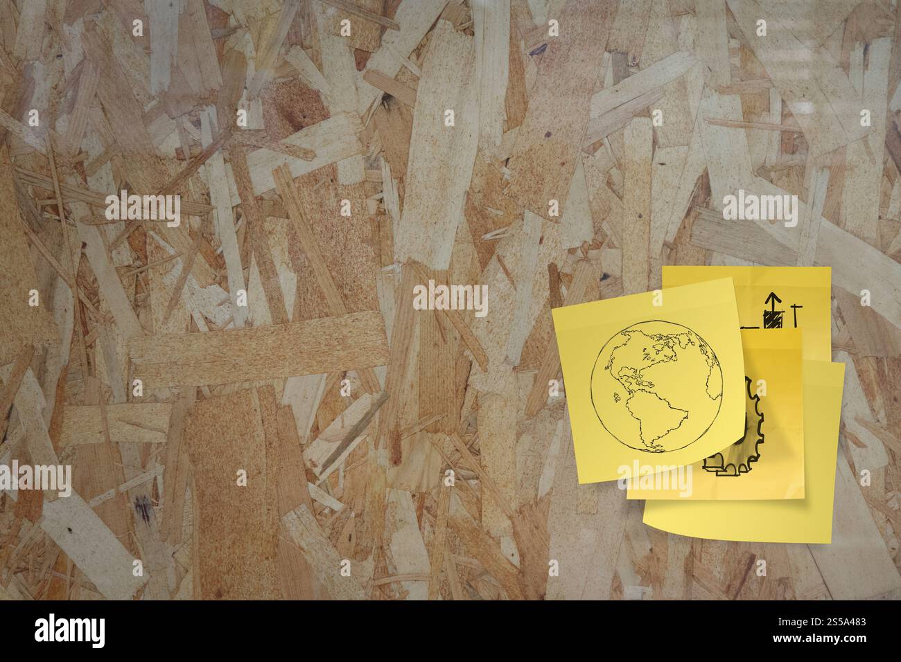 sticky paper note on recycled compressed wood chippings board as ...