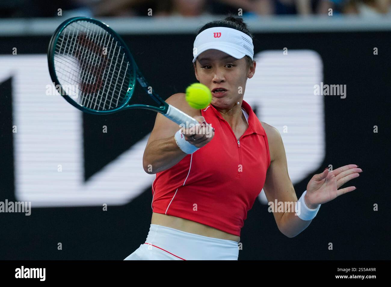 Wei Sijia of China plays a forehand return to Jasmine Paolini of Italy ...