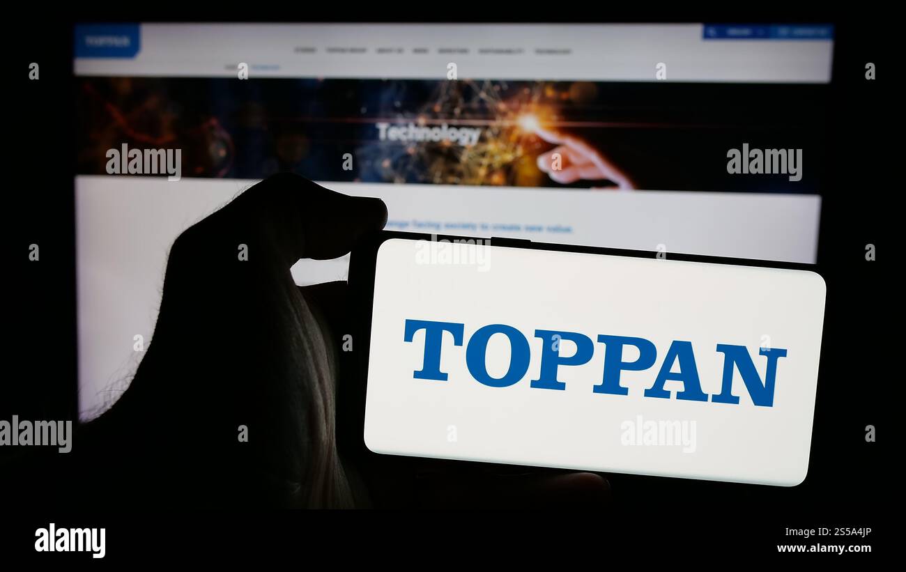 Germany. 16th Oct, 2024. In this photo illustration, a person is holding a mobile phone with the ...