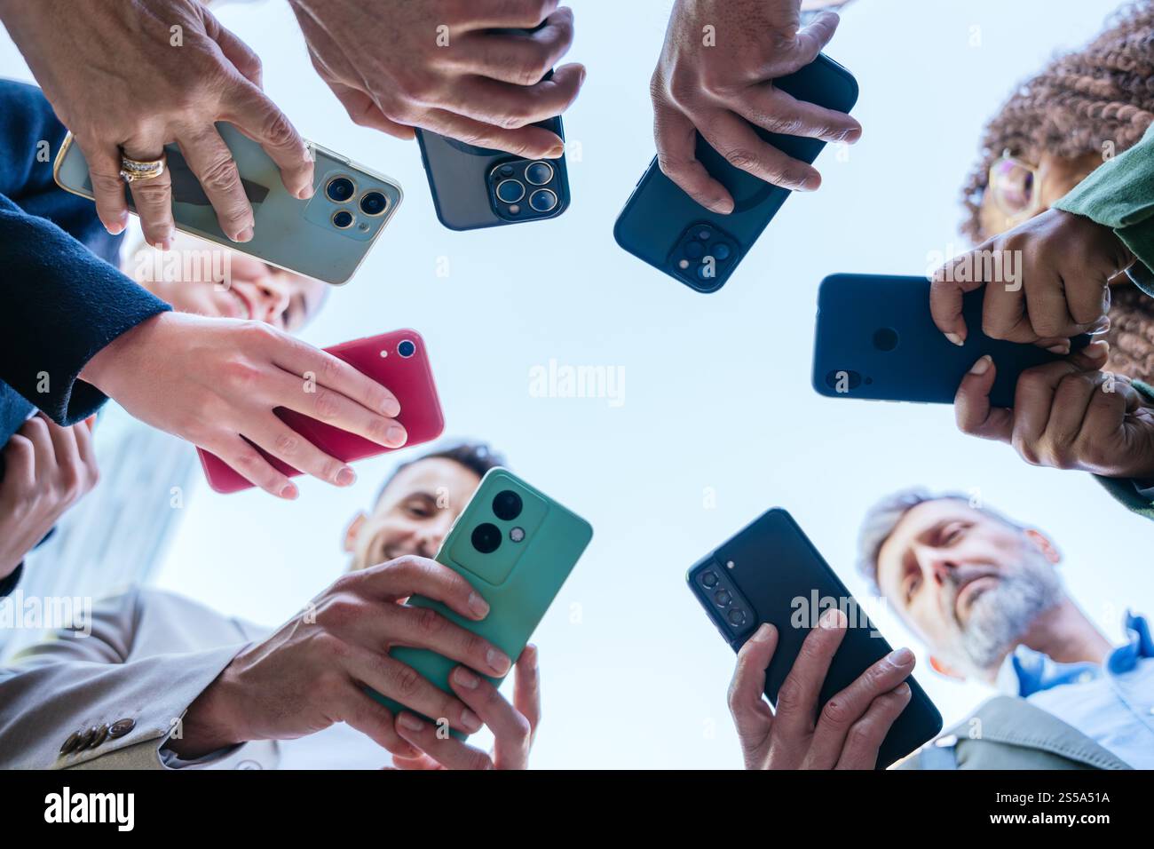 Group of People Holding Smartphones in a Circle Stock Photo - Alamy