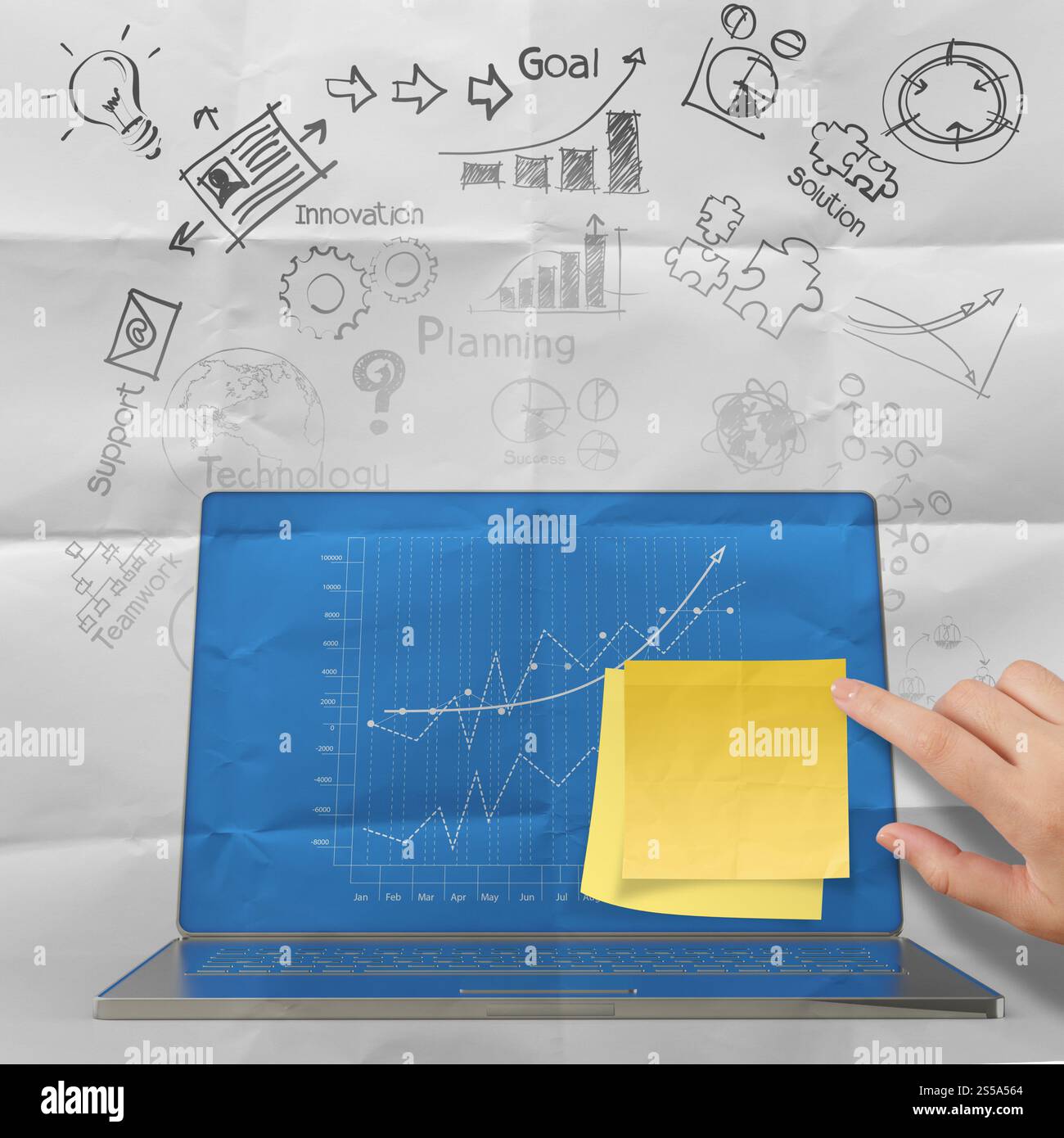 sticky note on crumpled paper with laptop computer and business diagram ...