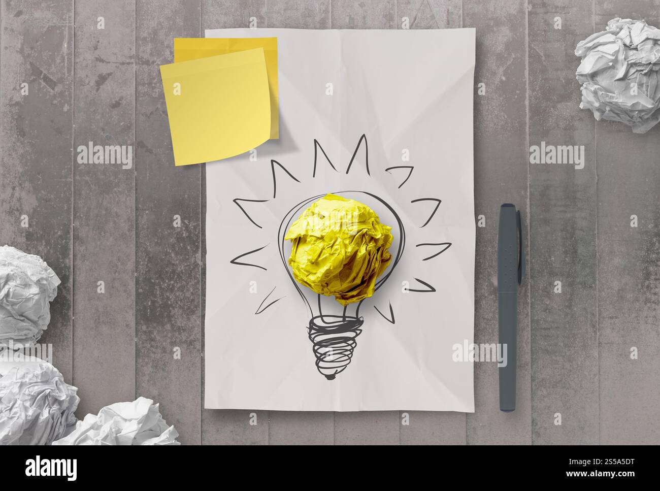 sticky note with another idea light bulb on crumpled paper as creative ...