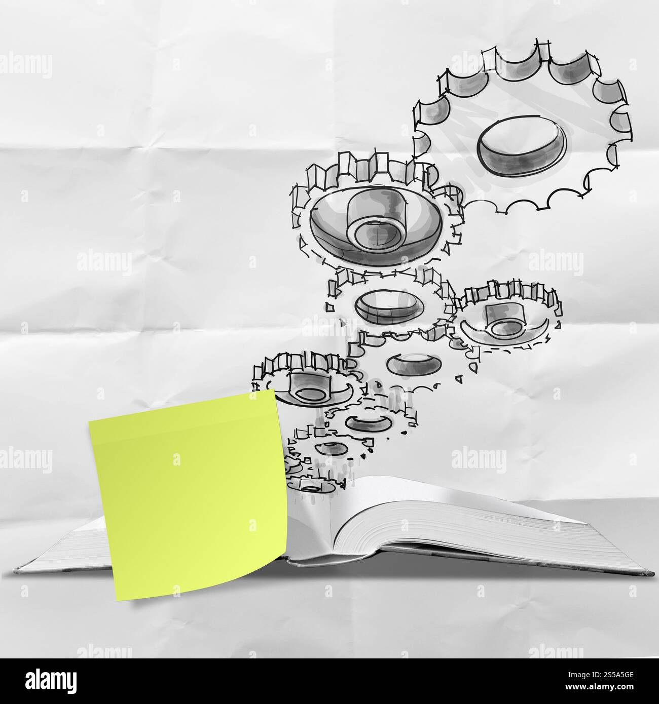 hand drawn gear cog with blank sticky note on crumpled paper as concept ...