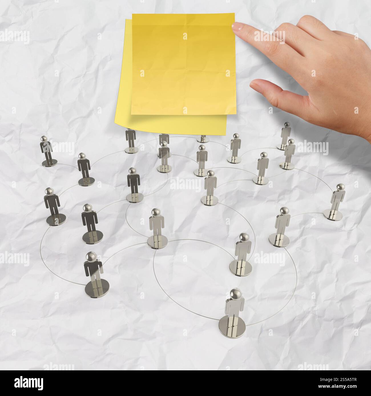 sticky note with human social network and leadership on crumpled paper ...