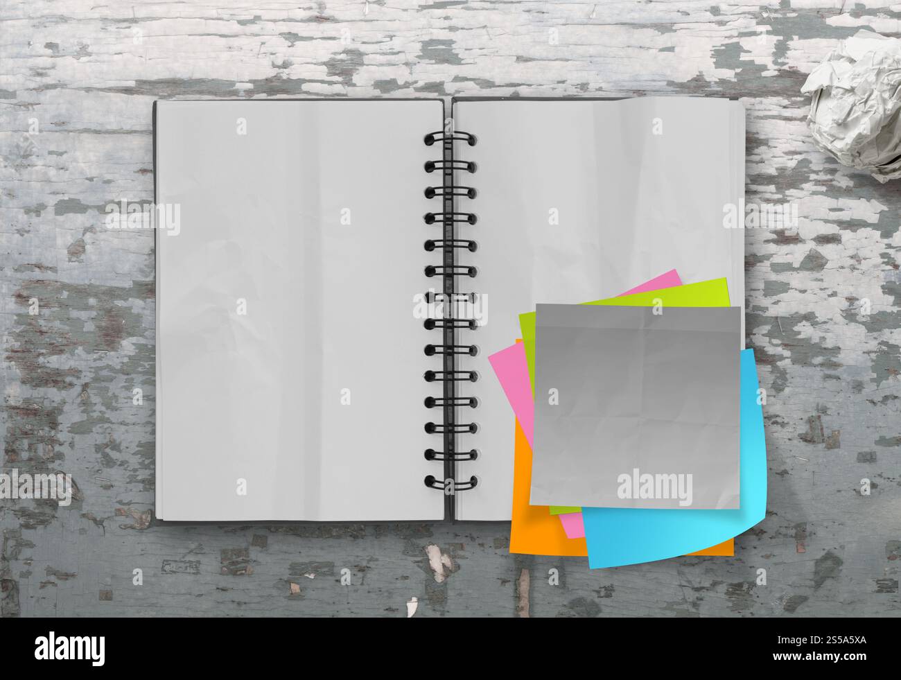 sticky notes with open blank note book on desk top texture Stock Photo ...