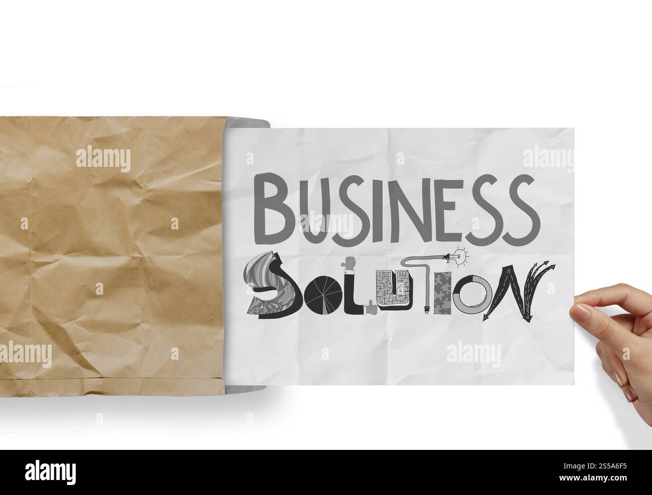 hand pulling crumpled paper from envelope with design word BUSINESS ...