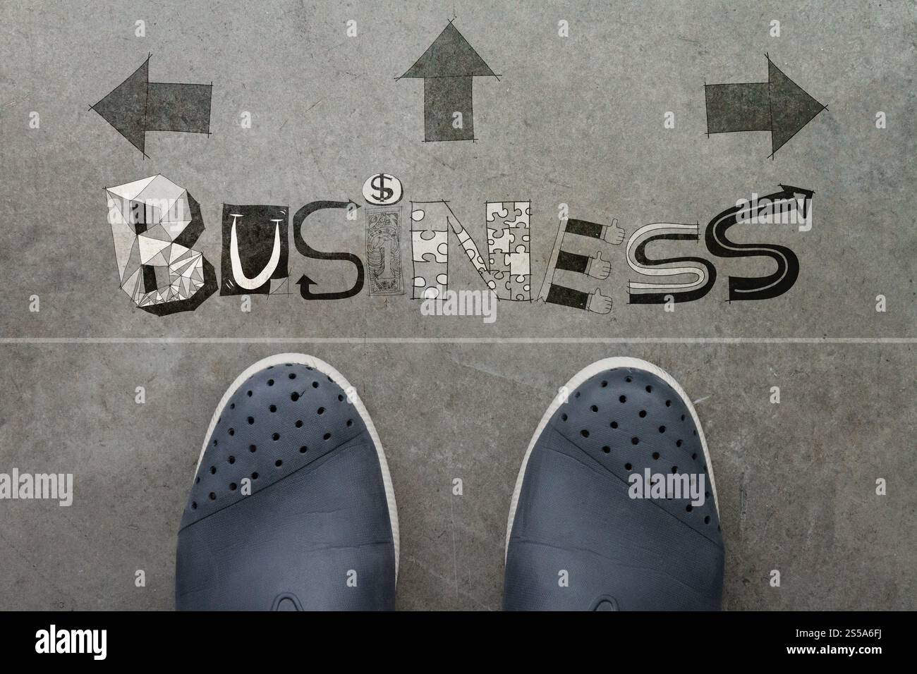 Hand drawn BUSINESS design word on front of business man feet as ...