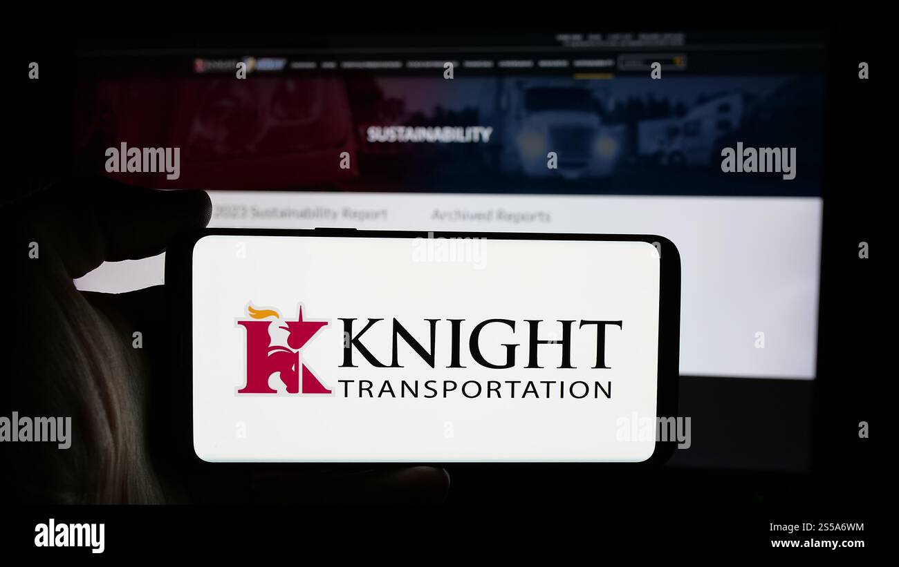 In this photo illustration, a person is holding a cellphone with the ...