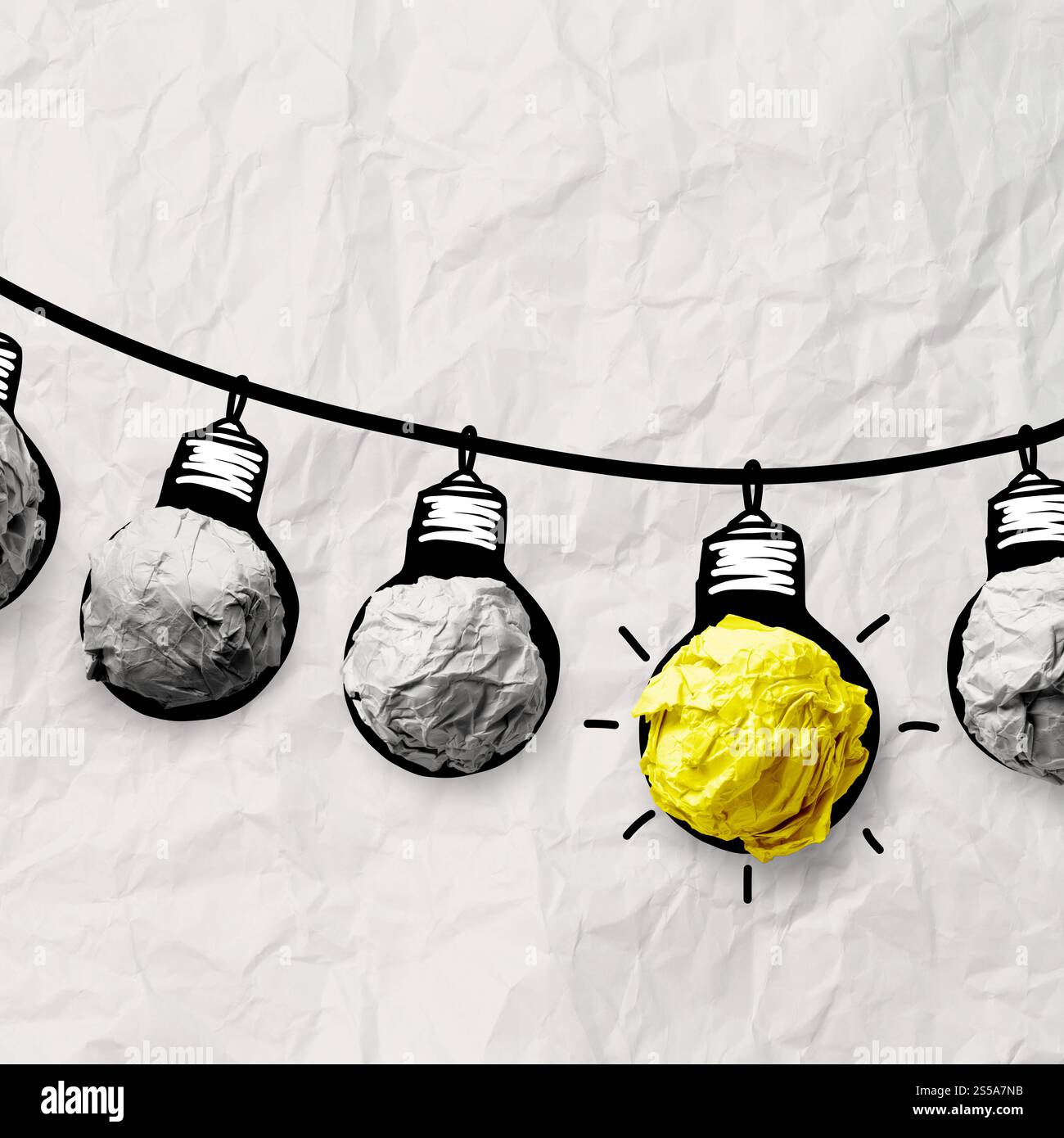 hand drawn light bulb on wire doodle with crumpled paper as leadership ...