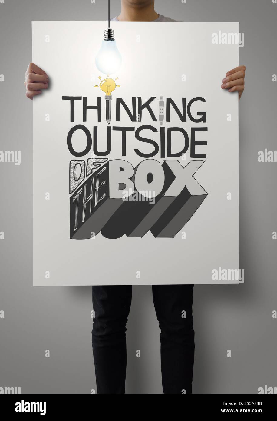 man showing poster of hand drawn word THINKING OUTSIDE OF THE BOX with ...