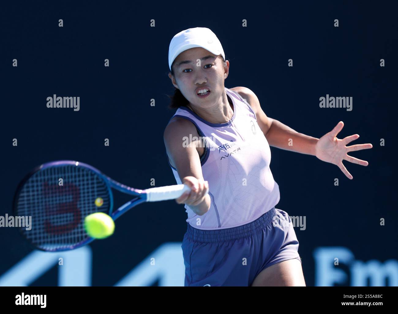 (250114) -- MELBOURNE, Jan. 14, 2025 (Xinhua) -- Zhang Shuai hits a ...