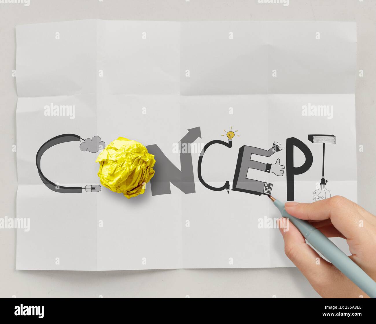 hand drawn design word CONCEPT with crumpled paper ball on paper ...