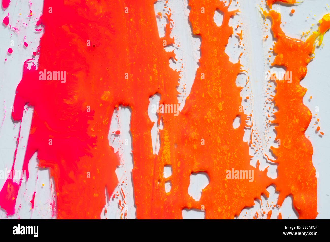 Abstract vibrant orange wet paint drops and splotch on white background ...
