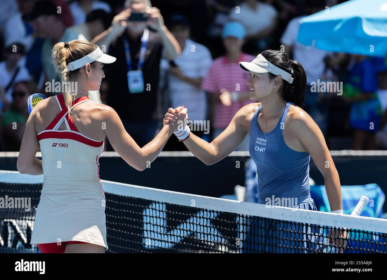Melbourne, Australia. 14th Jan, 2025. Wang Yafan (R) shakes hand with ...