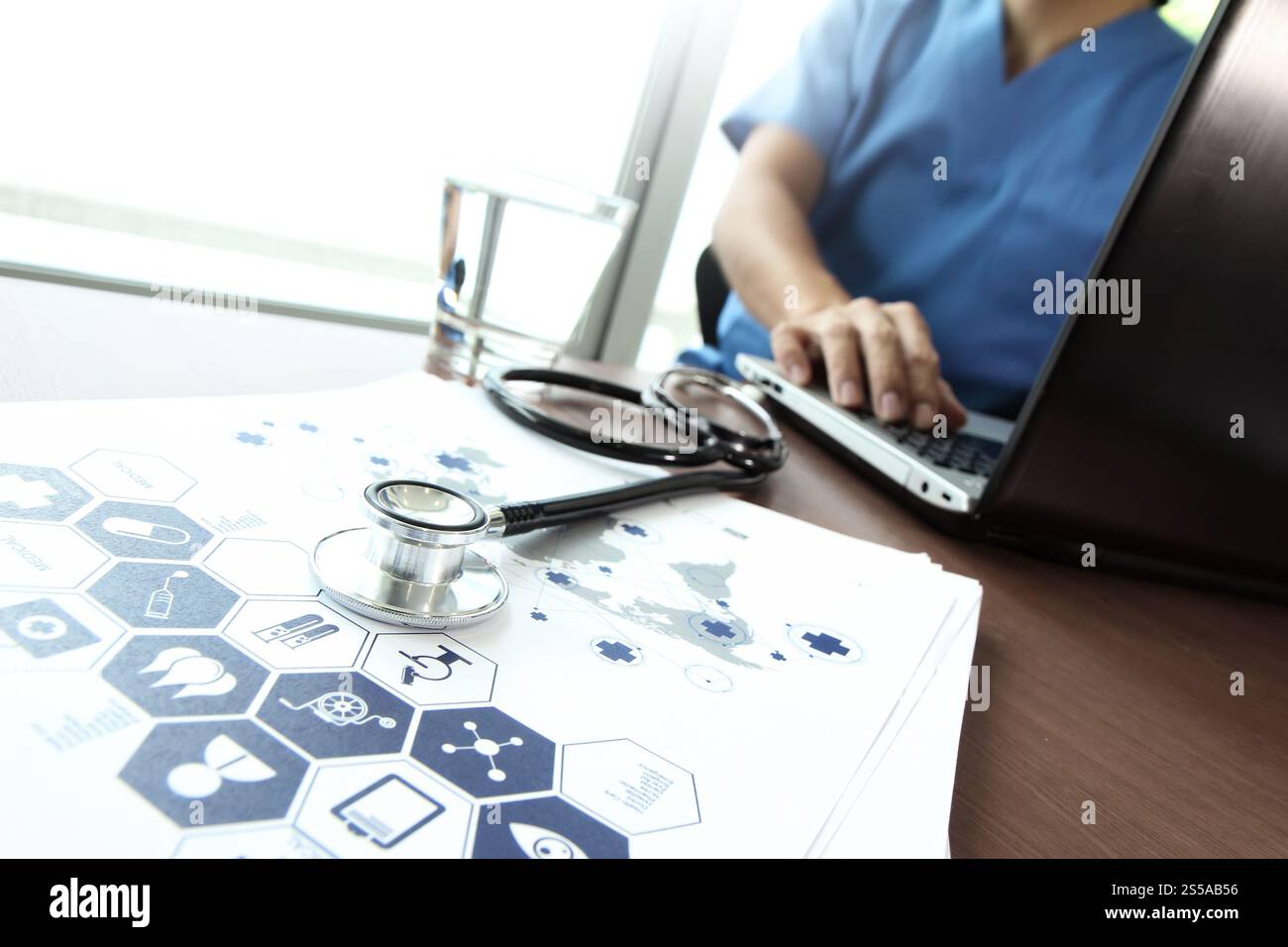 Doctor working with laptop computer in medical workspace office and ...