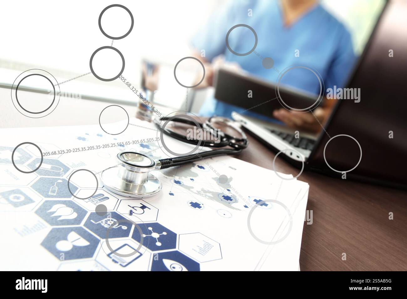 Doctor working with laptop computer in medical workspace office and ...