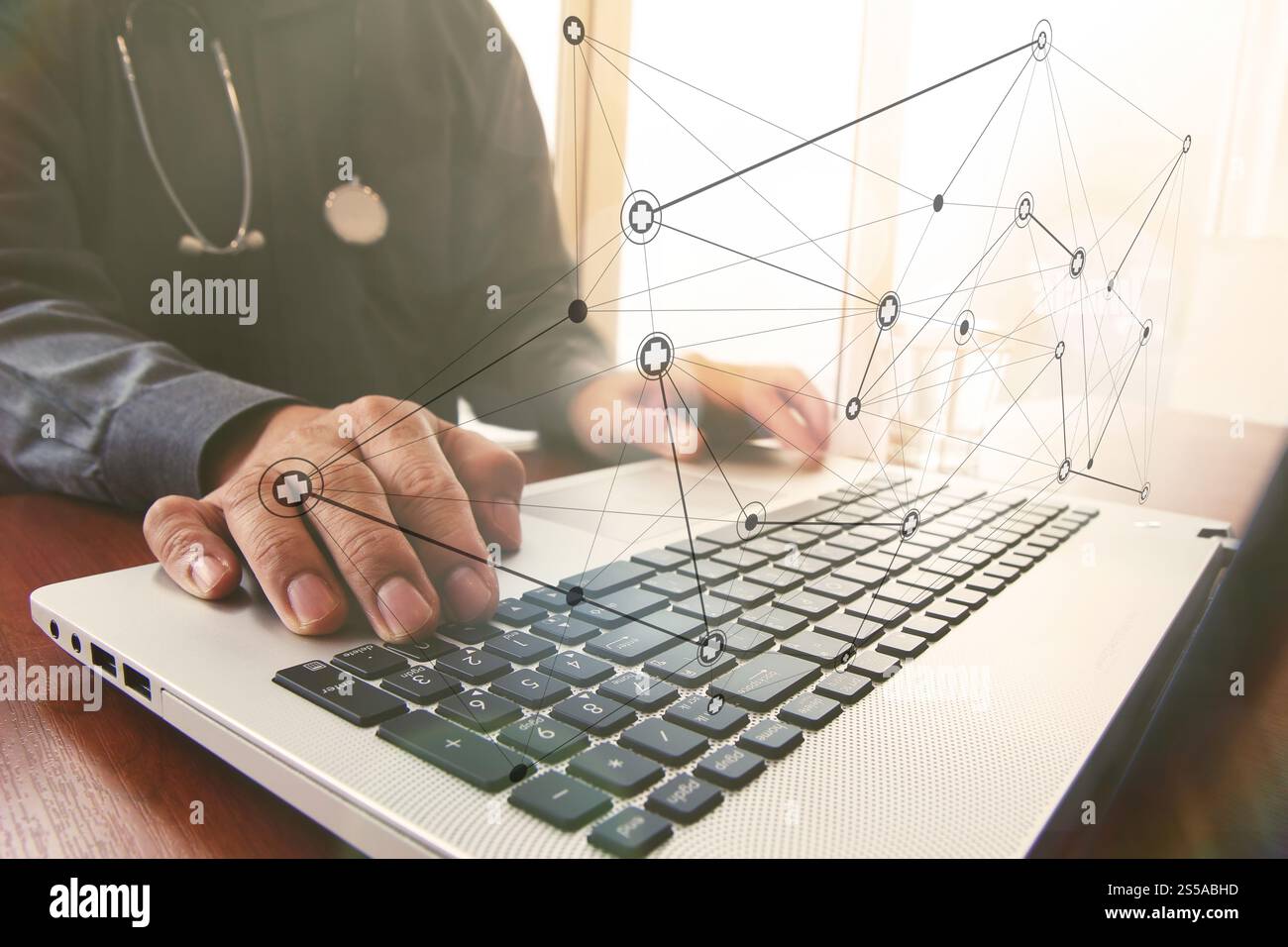 Doctor working with laptop computer in medical workspace office and ...