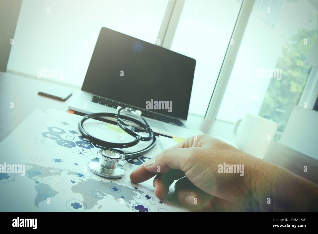 Doctor working with laptop computer in medical workspace office and ...