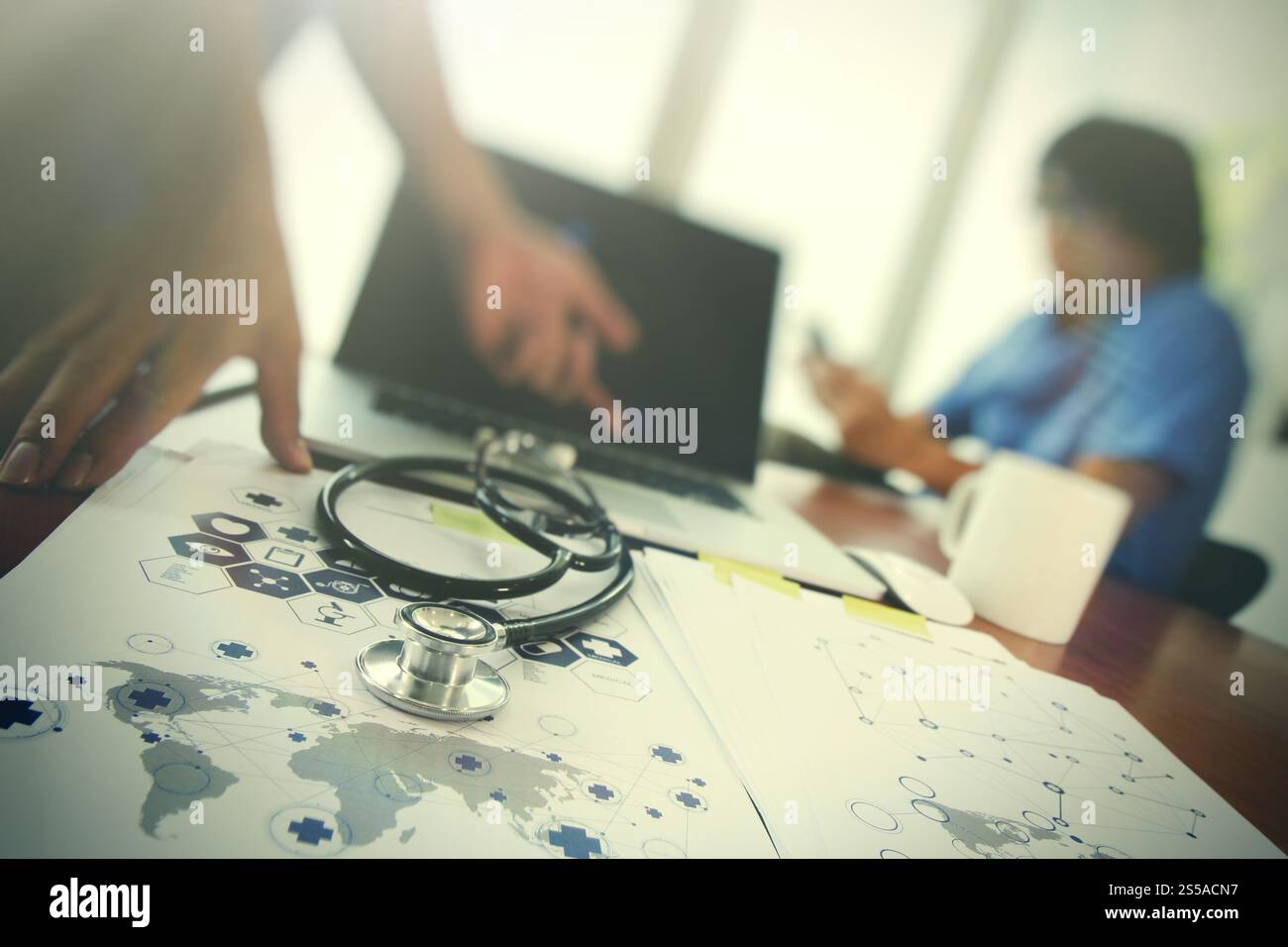 team doctor working with laptop computer in medical workspace office ...