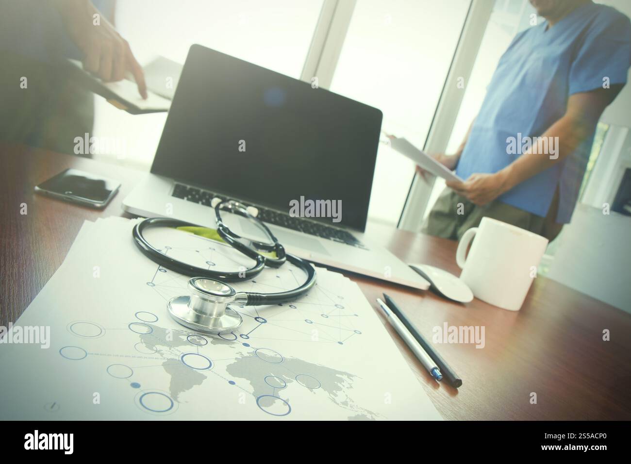 team doctor working with laptop computer in medical workspace office ...