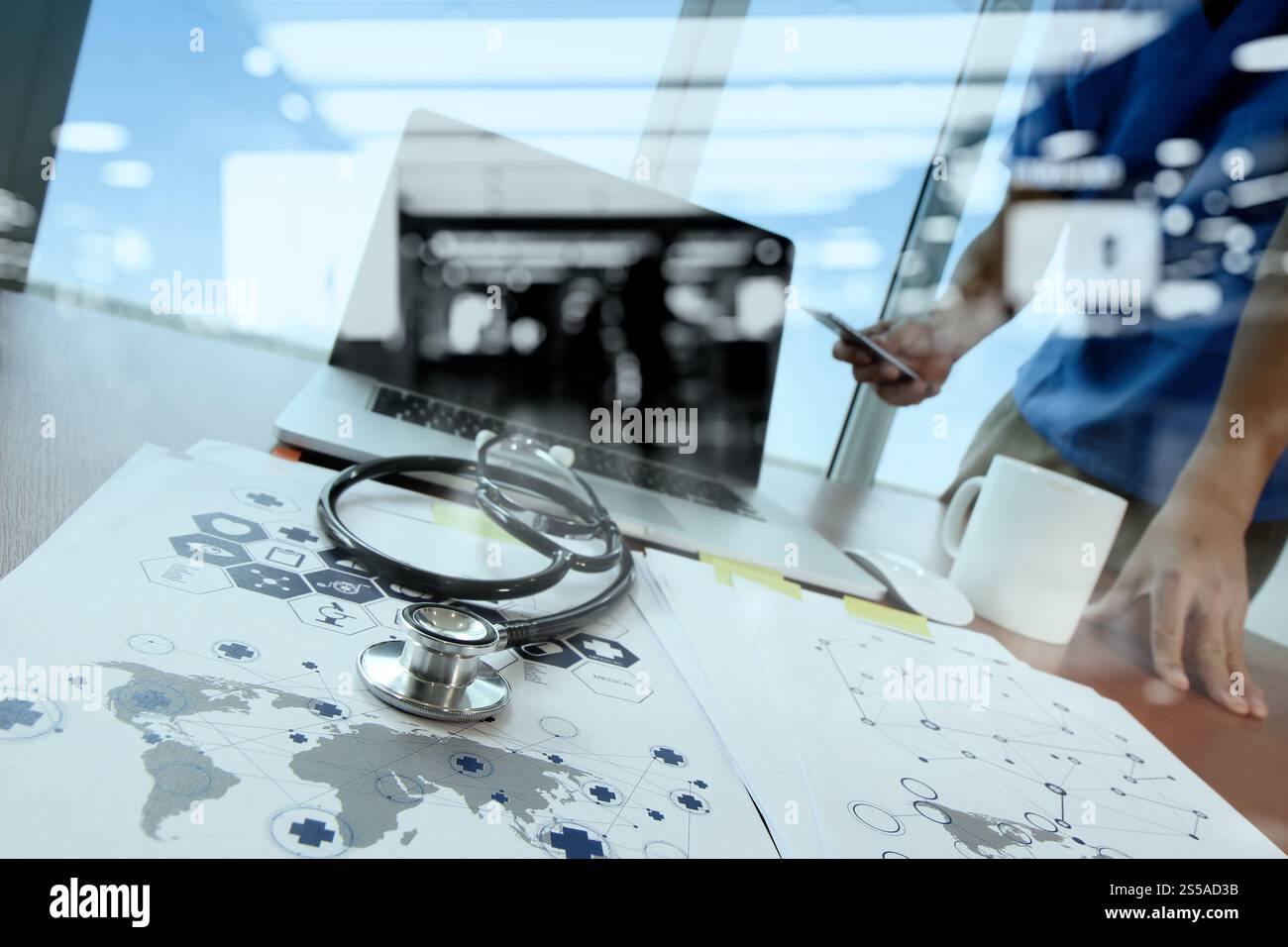 Doctor working with digital tablet and laptop computer in medical ...