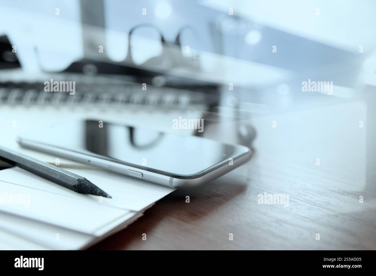 business documents on office table with smart phone and digital tablet ...