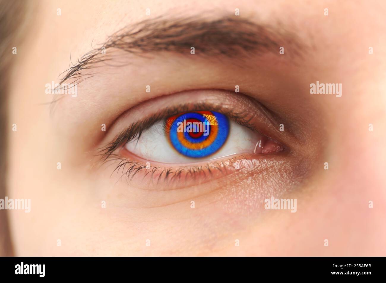 Hypnosis. Spiral symbolizing hypnotic effect in woman's eye, closeup ...