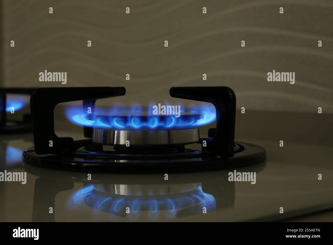 Gas burner of modern stove with burning blue flame Stock Photo - Alamy