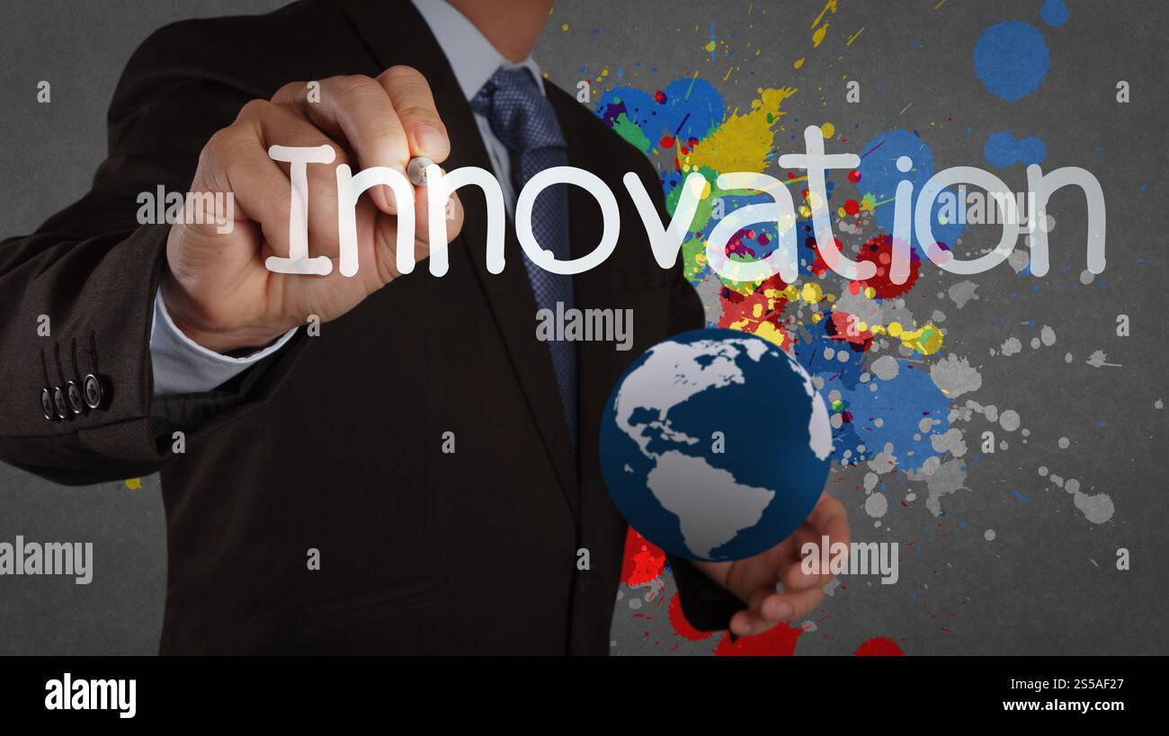 businessman hand writing innovation on splash color background as ...