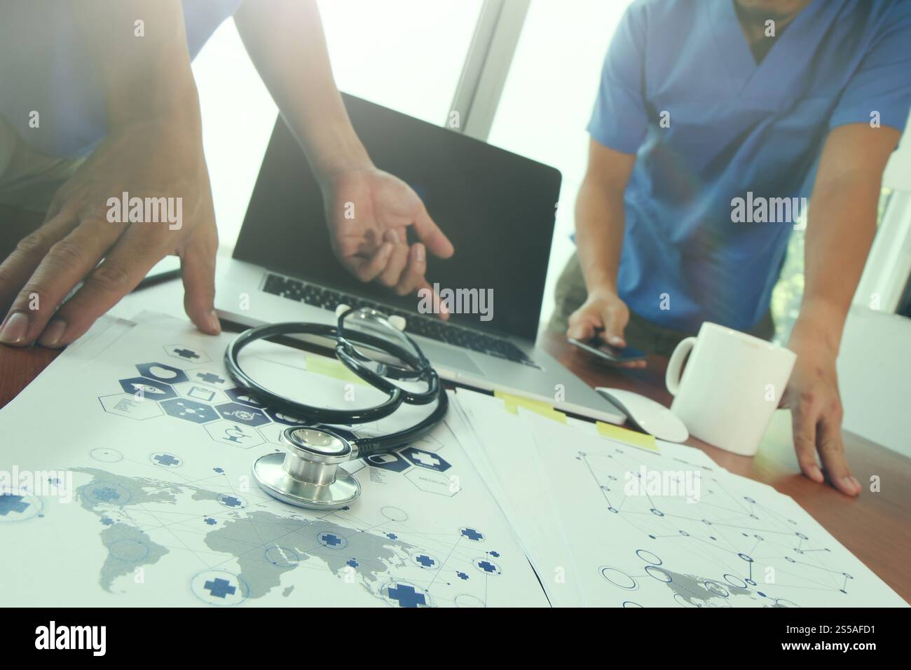 team doctor working with laptop computer in medical workspace office ...