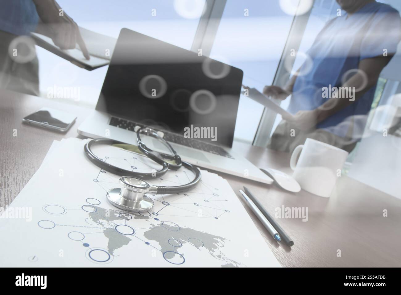 team doctor working with laptop computer in medical workspace office ...