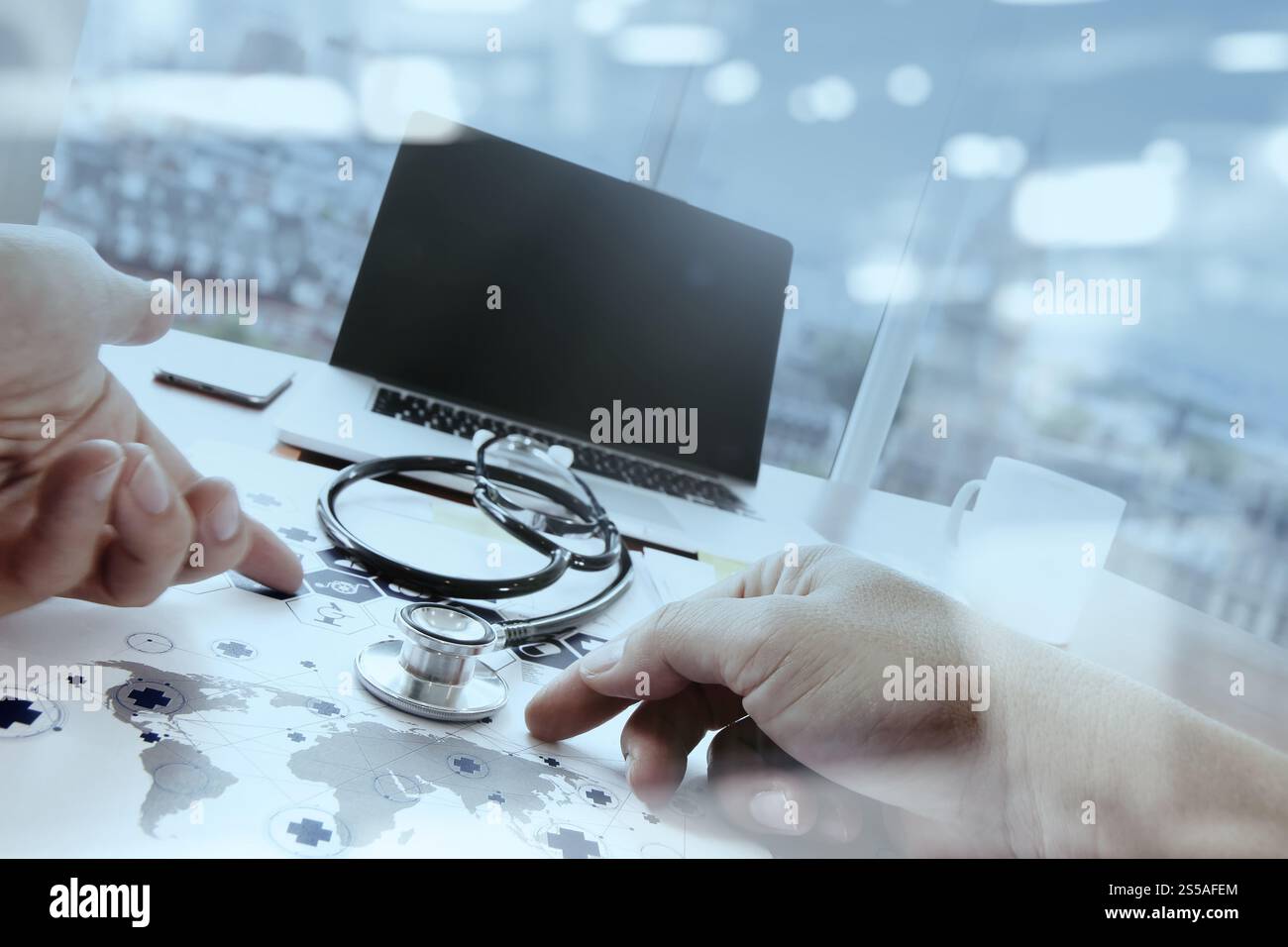 Doctor working with digital tablet and laptop computer in medical ...